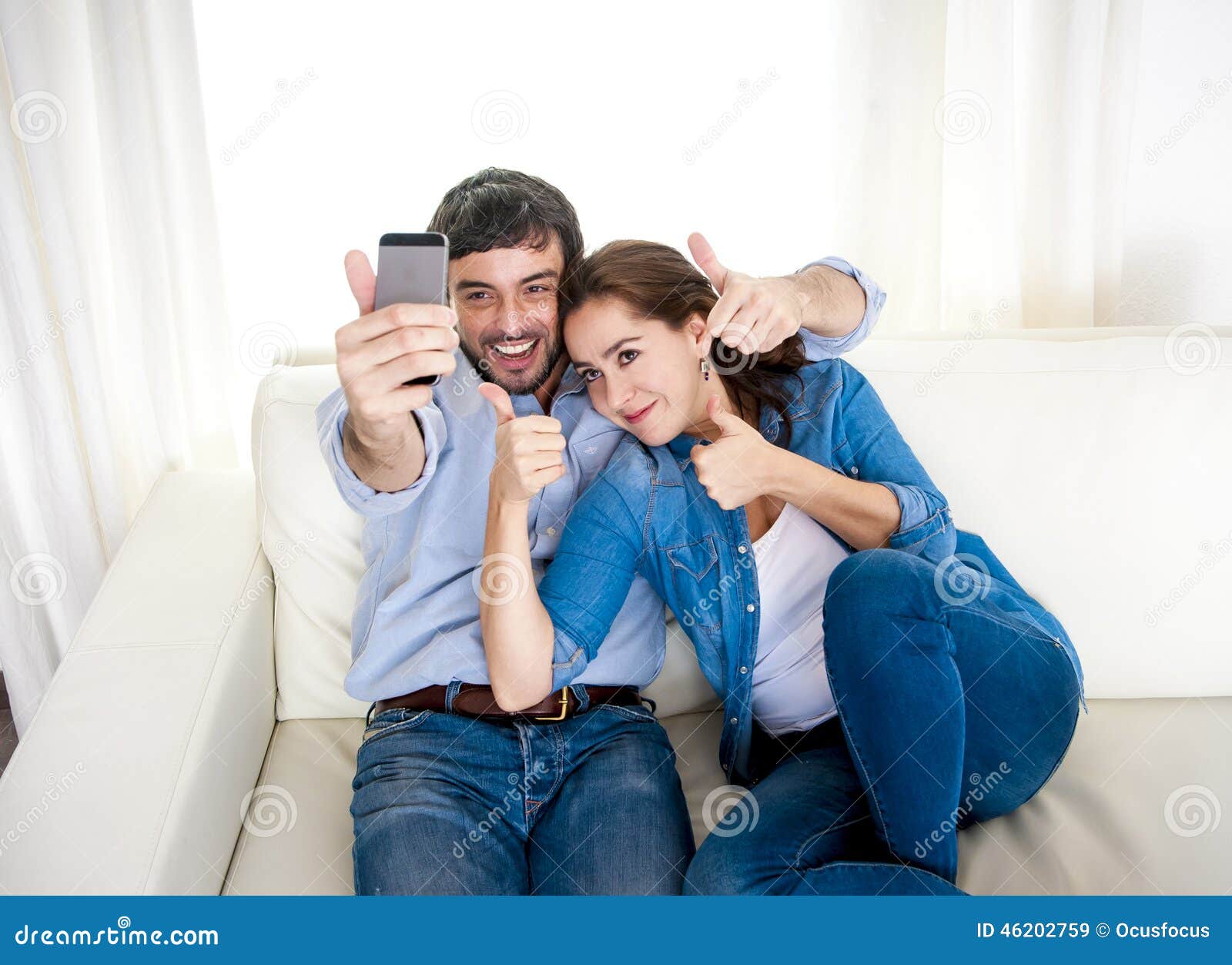 Nice Attractive Young Couple Sitting Together In Sofa Couch Taking