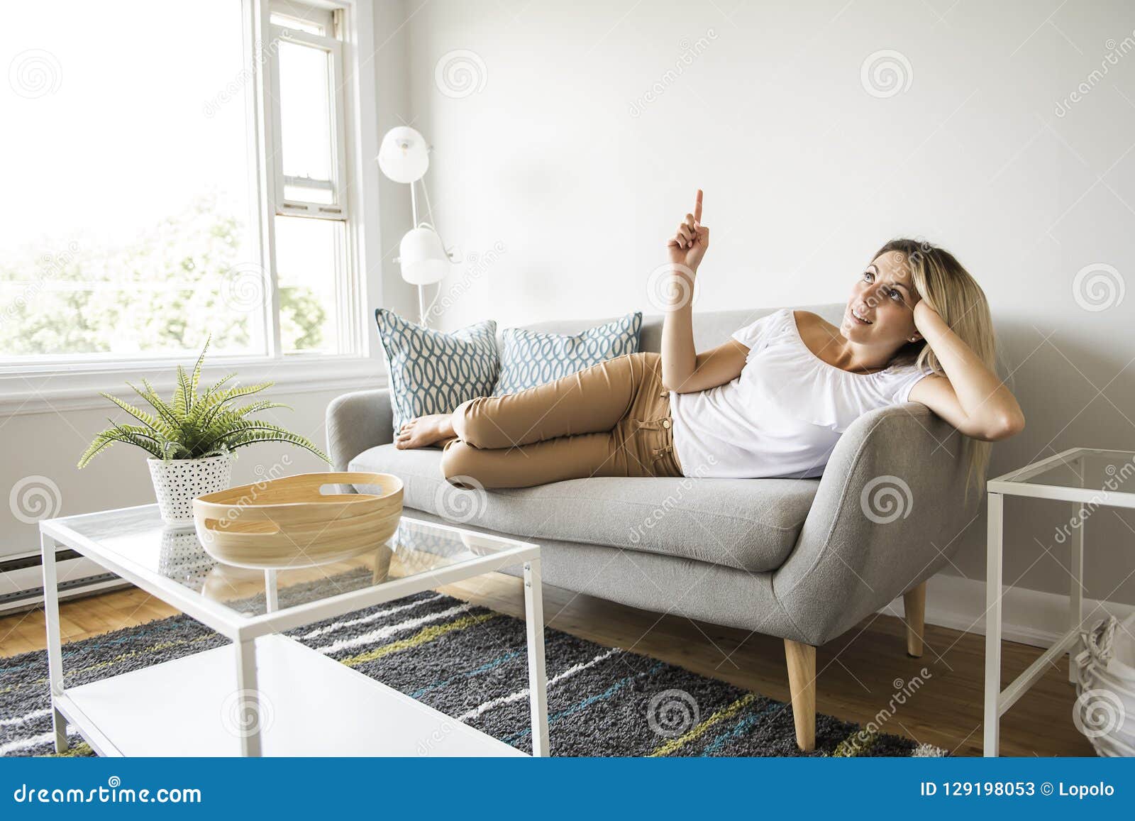 Nice Blond Women Sit On The Sofa At Home Stock Image Image Of Front