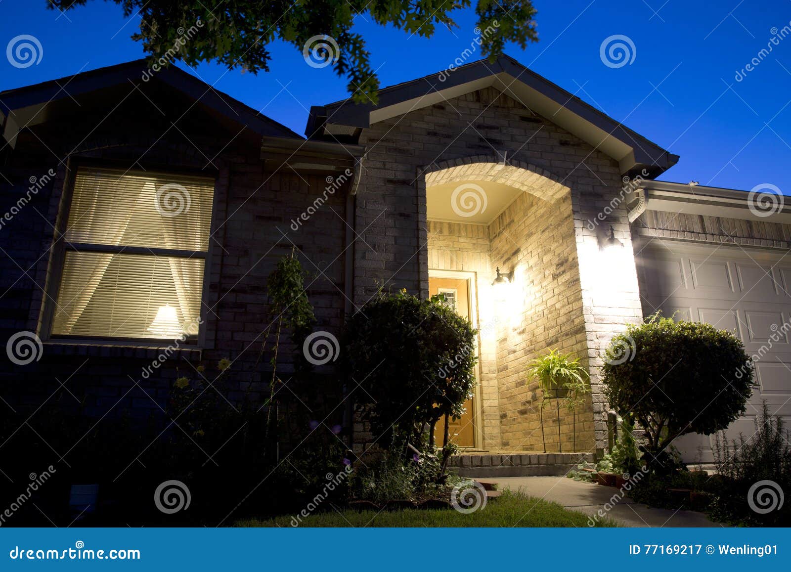 A Nice Brick House at Night Stock Image - Image of family, room: 77169217