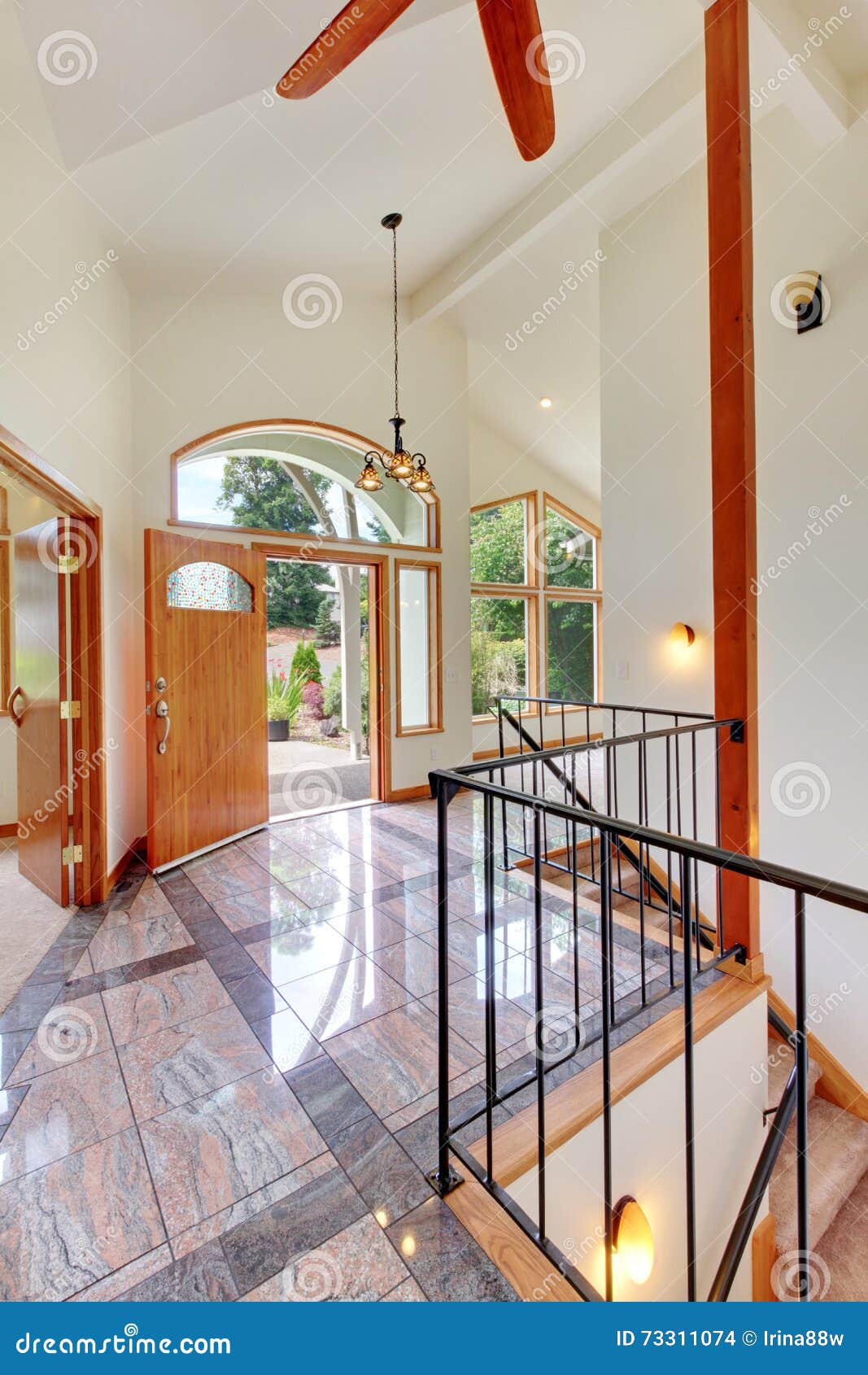 Nice Bright Entry Way To Home with High Vaulted Ceiling, Tile Floor and ...