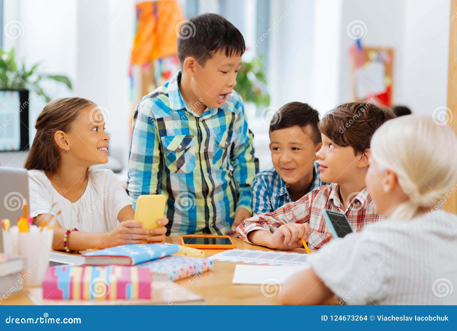 Nice Children Having a Small Break in a Classroom Stock Photo - Image ...