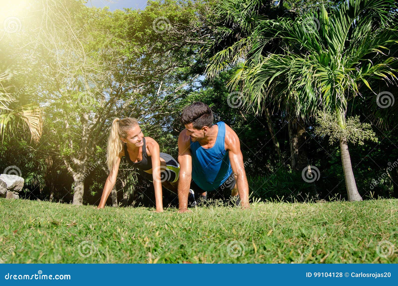 Couple push up at the park stock photo. Image of instructor - 99104128