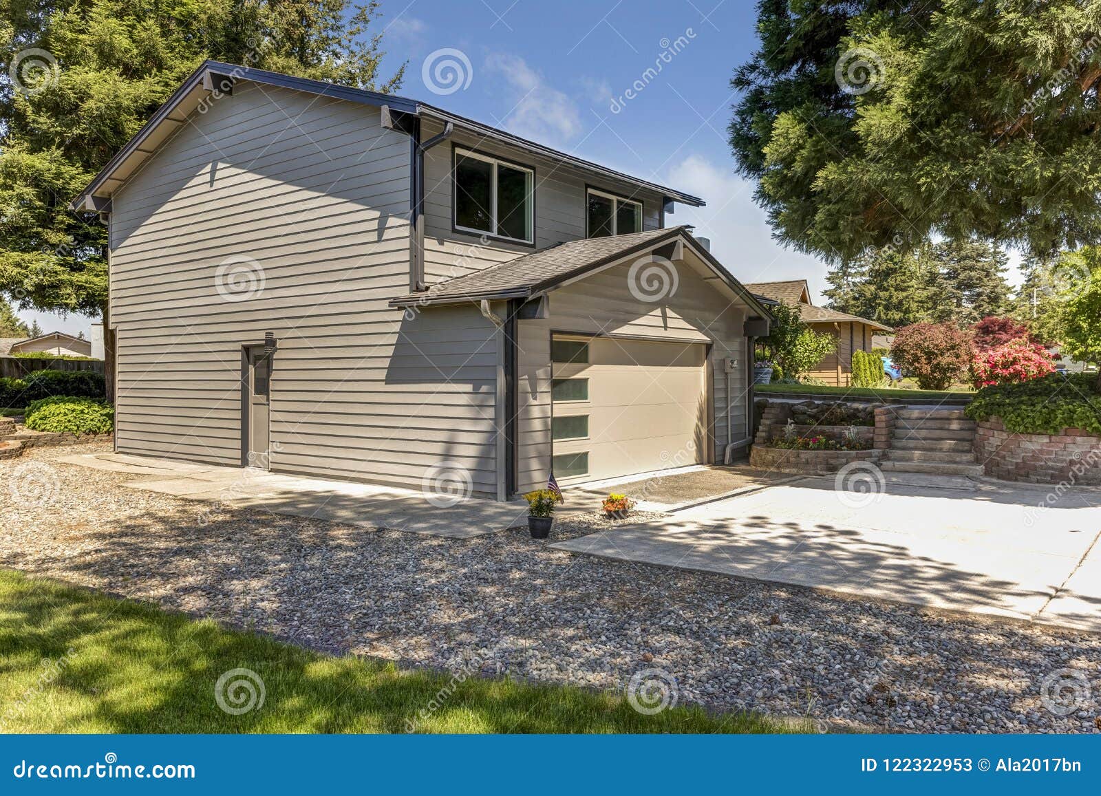 Nice Front View of Blue House with Attached Garage. Stock Image - Image ...