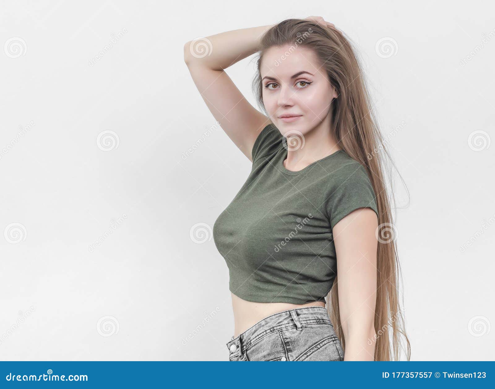 Nice Girl With Beautiful Breasts In A Green T Shirt Posing On Ca Stock