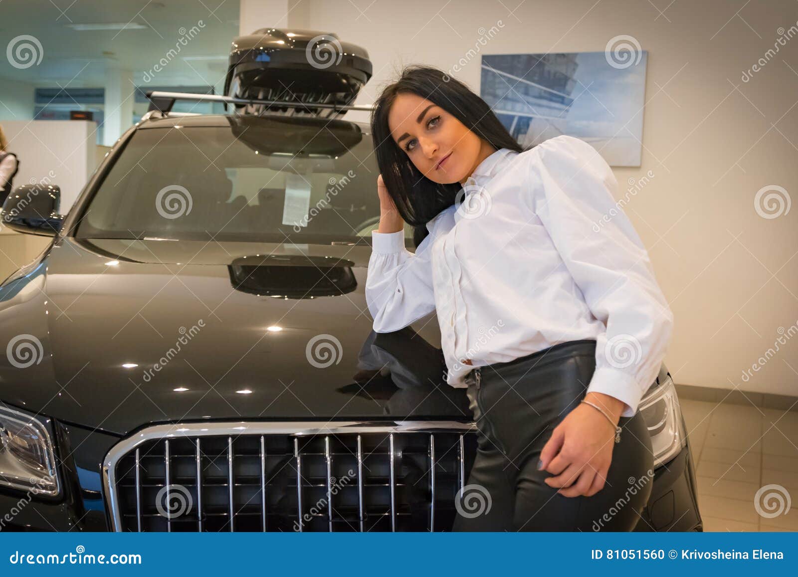 Nice girl in a car shop stock photo. Image of driver - 81051560