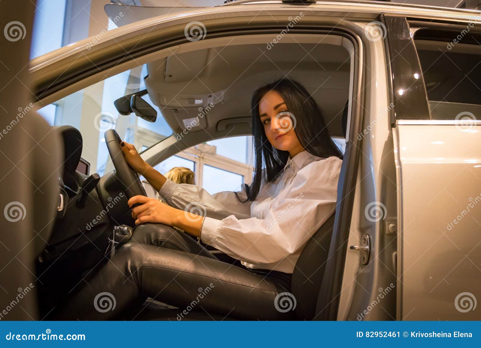 Nice girl in a car shop stock image. Image of buyer, dealer - 82952461