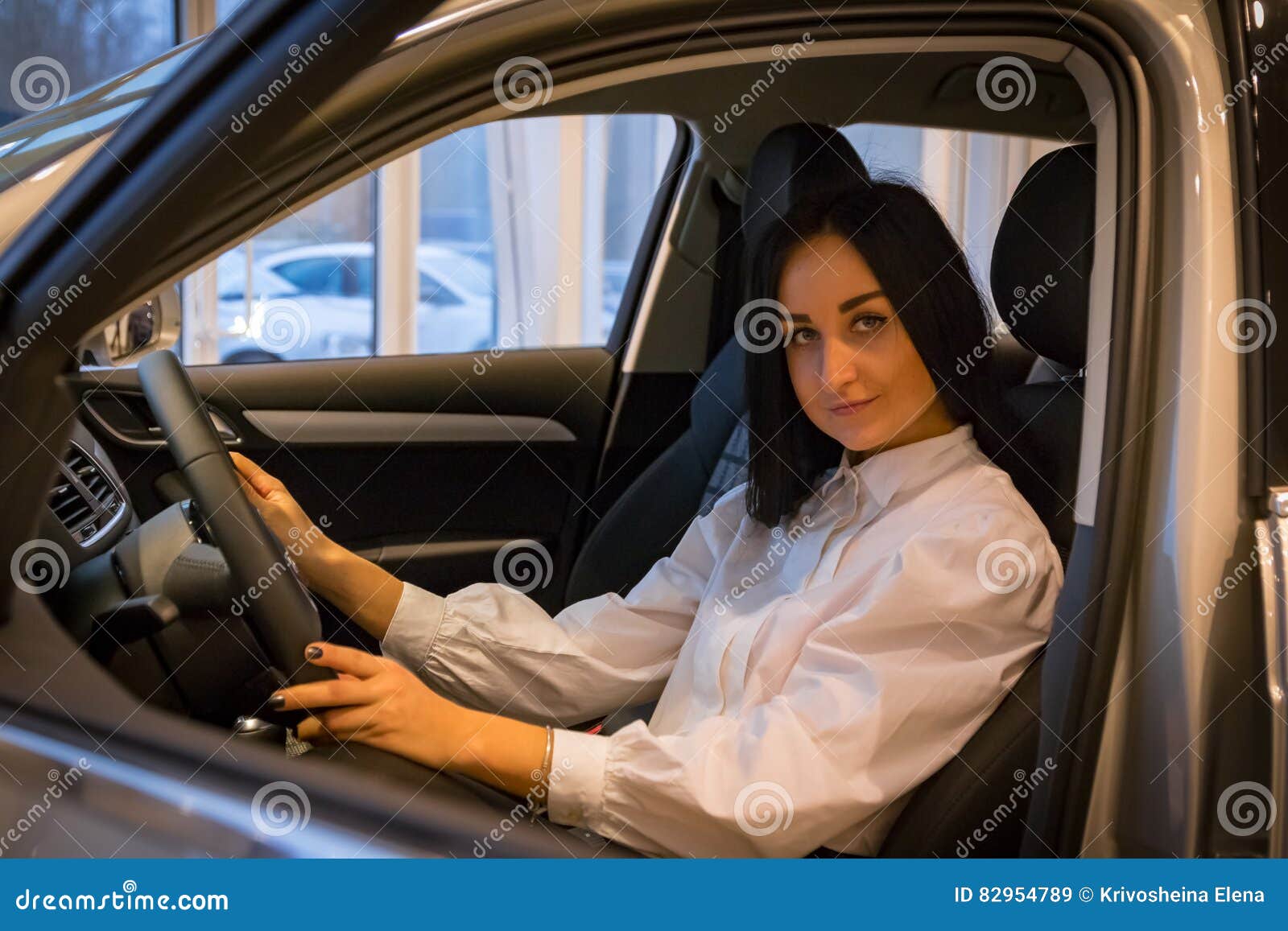 Nice girl in a car shop stock image. Image of hair, driver - 82954789
