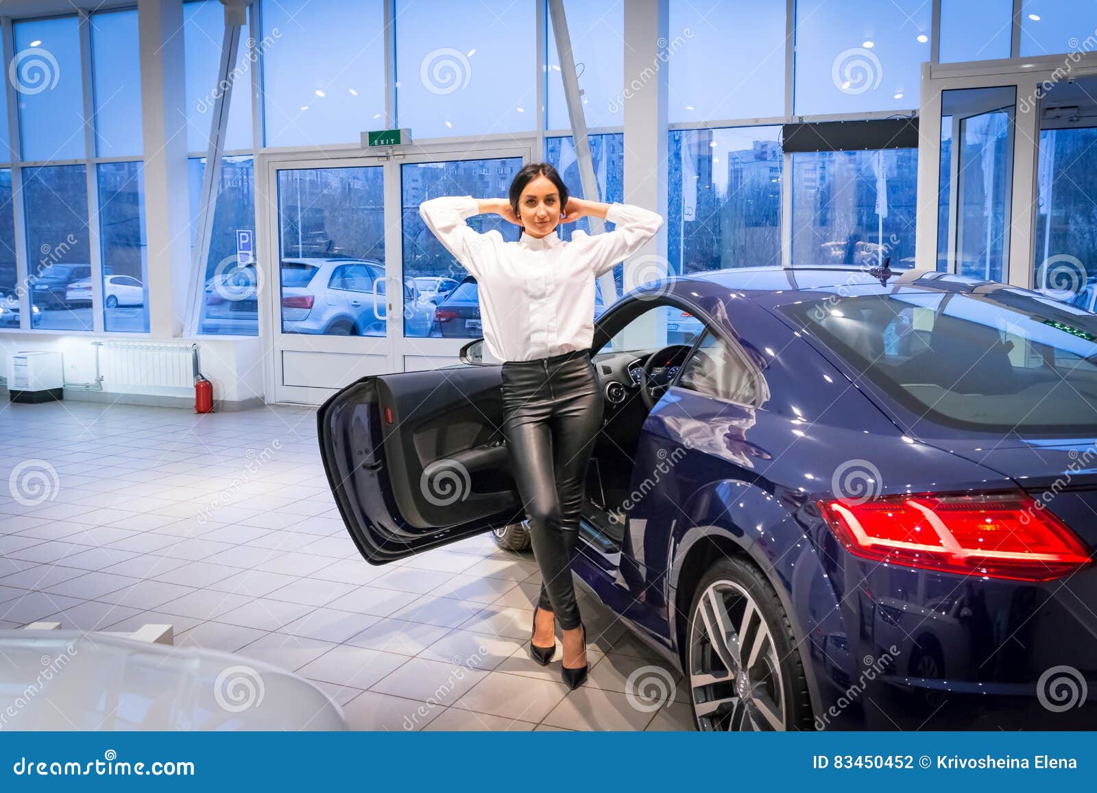Nice girl in a car shop stock photo. Image of russian - 83450452