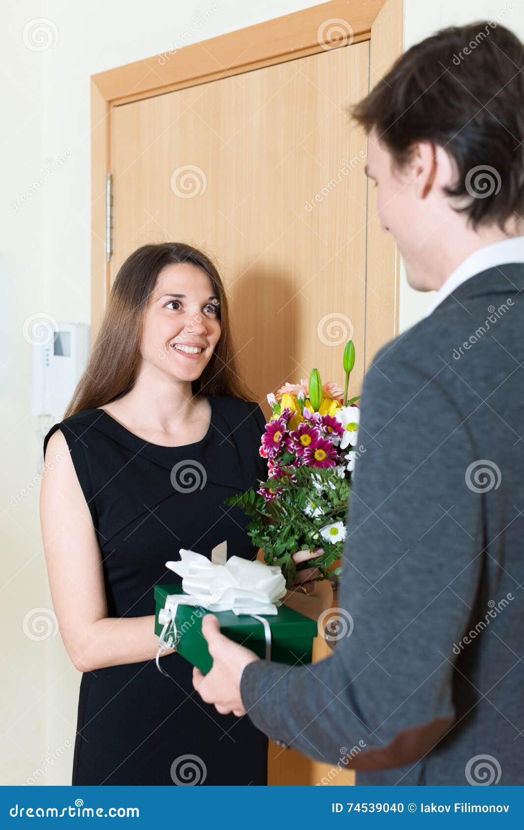 Nice girl giving gift stock photo. Image of bunch, interior - 74539040