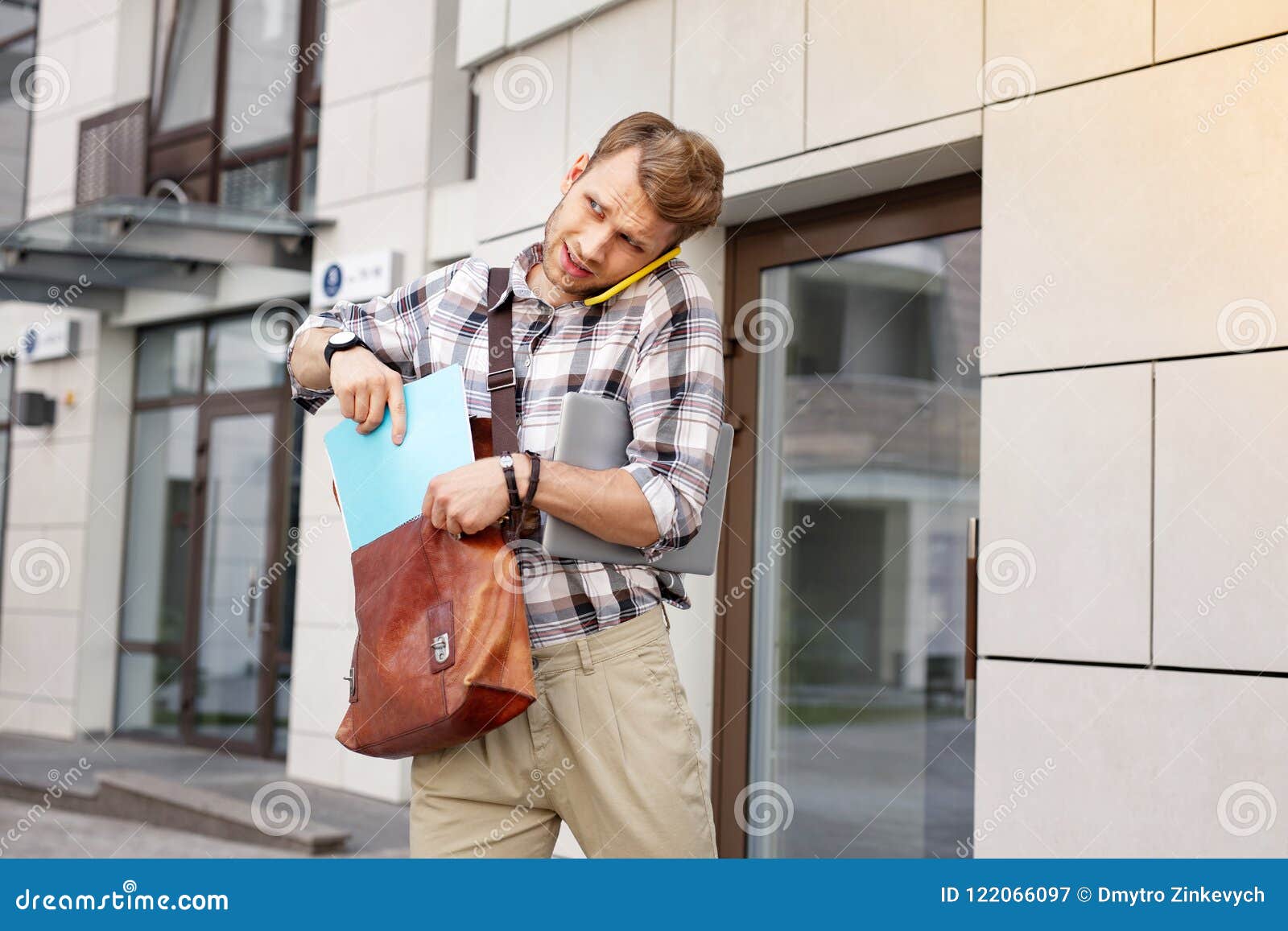 Nice Handsome Man Putting a Notebook in the Bag Stock Image - Image of ...