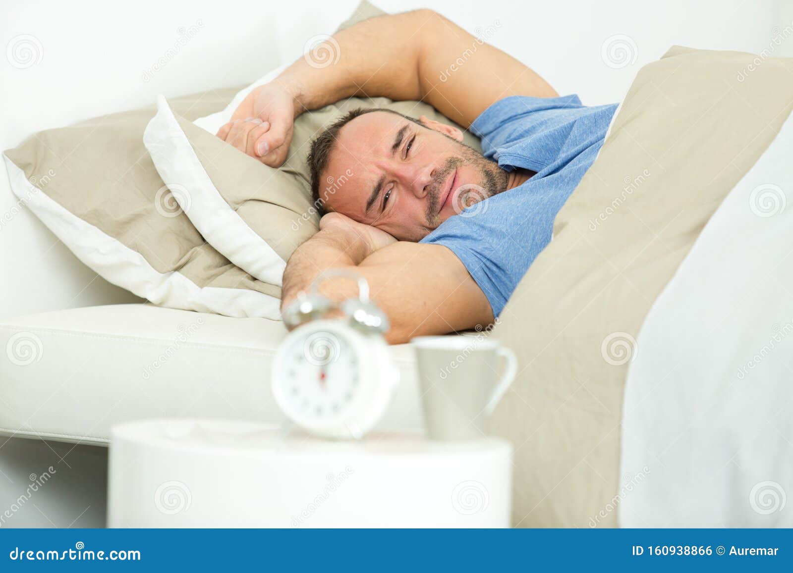 Handsome man waking up stock photo. Image of beautiful - 160938866