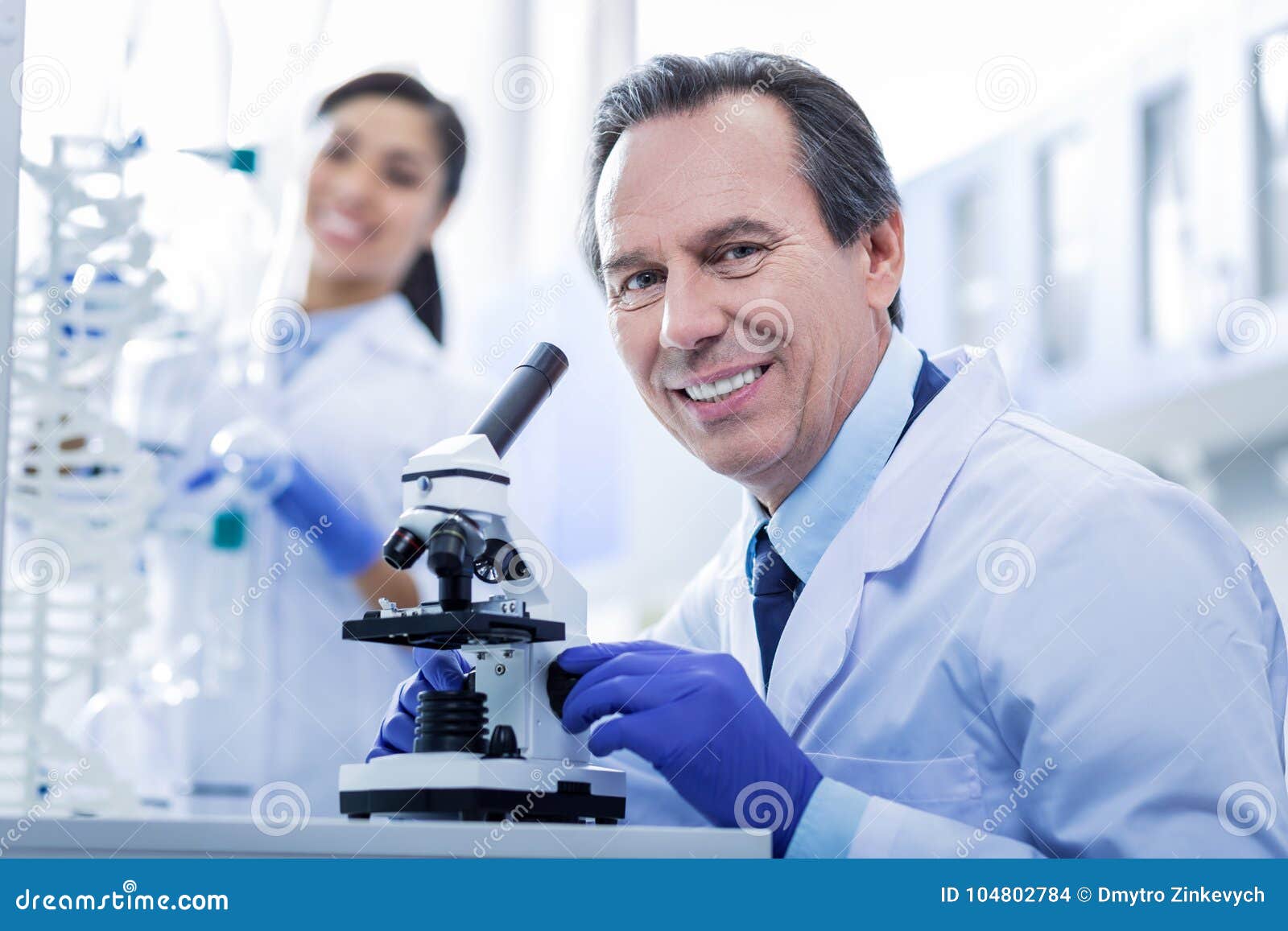 Nice Happy Man Holding a Microscope Stock Photo - Image of professional ...