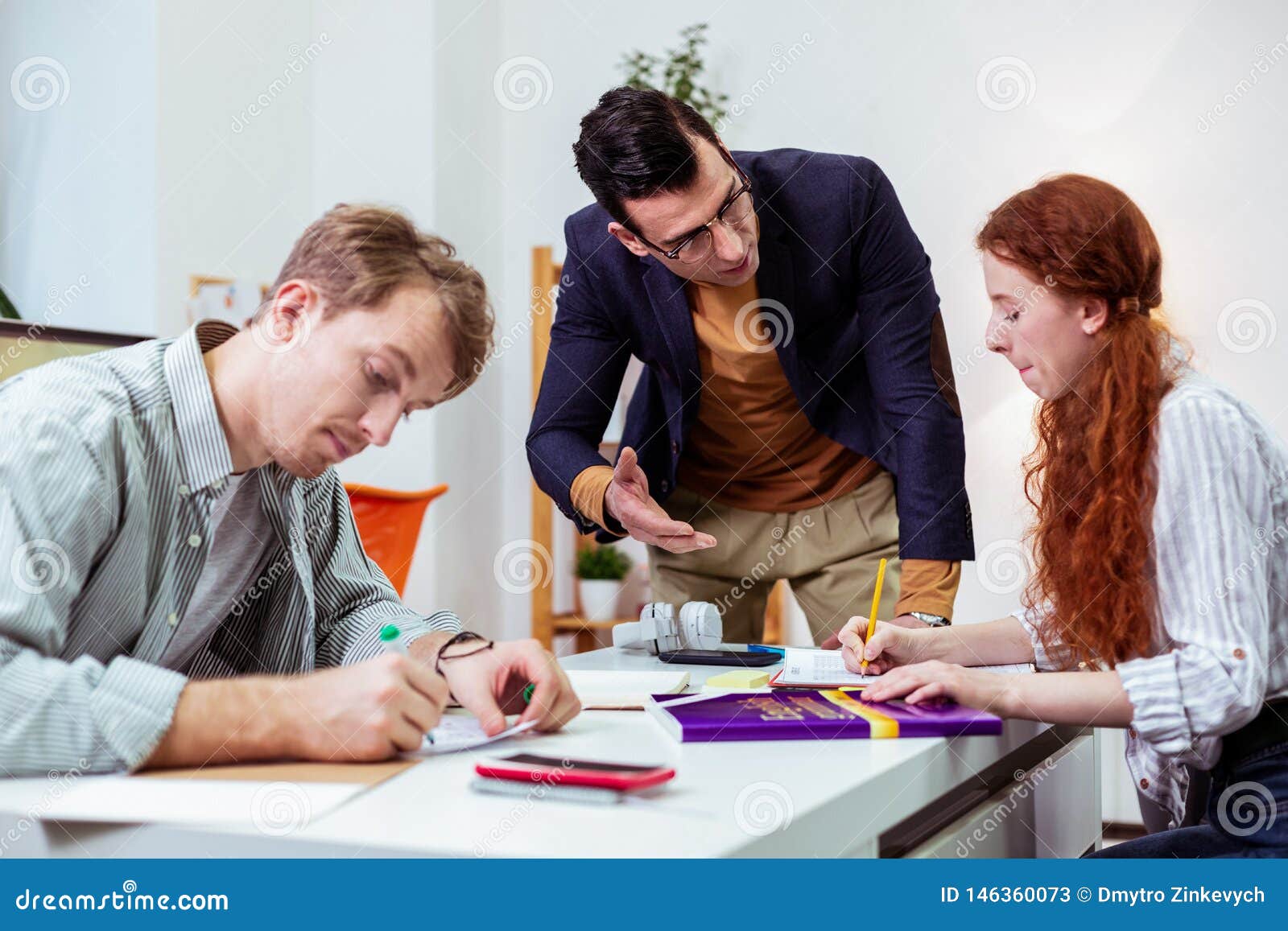 Nice Hard Working Student Taking Notes after the Teacher Stock Image ...