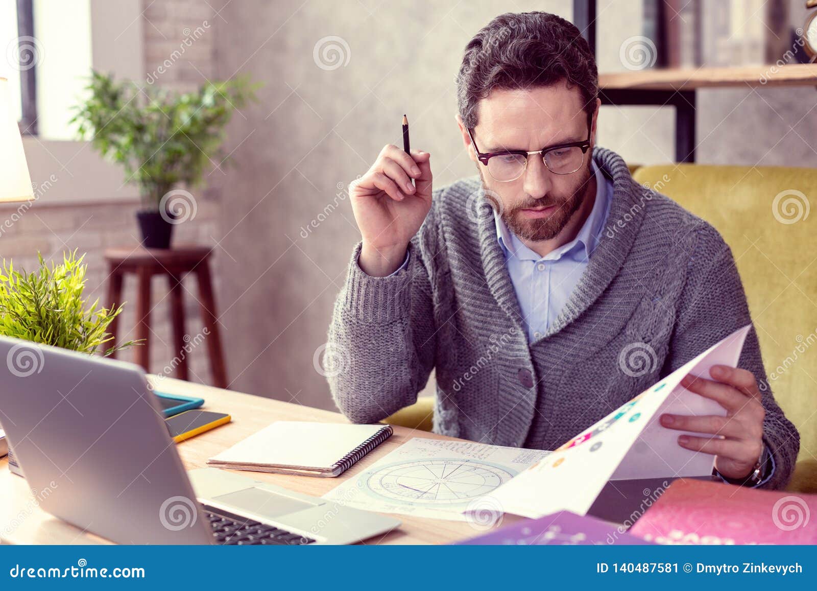 Bearded Astrologist Sitting In Armchair Reading Book And Doing Practice ...