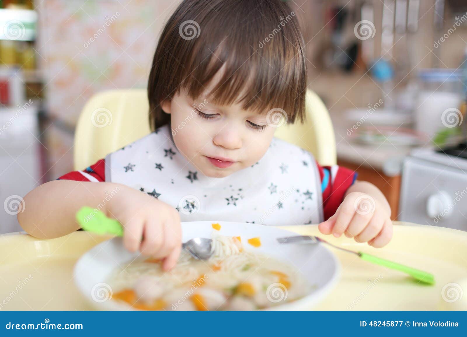 Nice little boy eats soup stock image. Image of young - 48245877