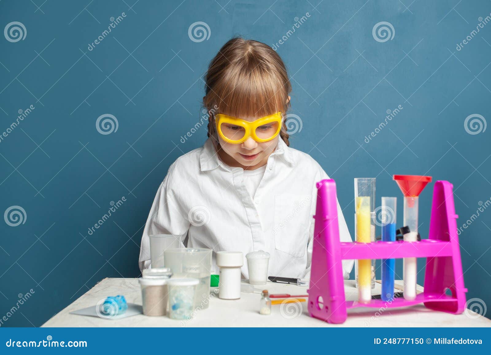 Nice Little Girl Looking at Flask and Science Equipment Stock Photo ...