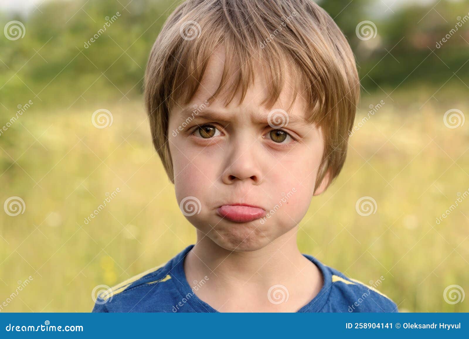 Nice Offended Boy with Insulted Expression Face, Purses His Lips in ...