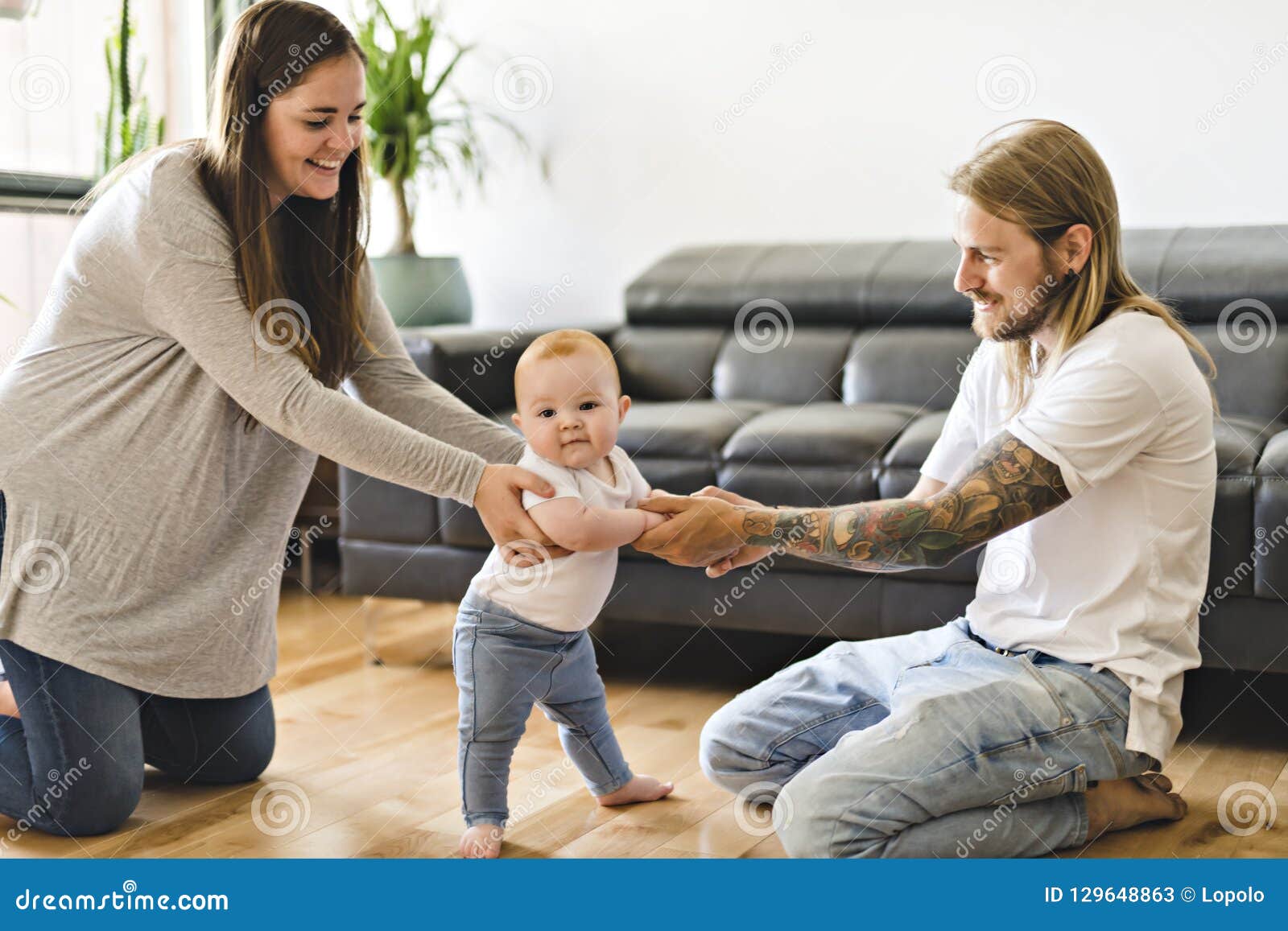 Parent Help Baby Daughter Take First Steps at Home Stock Image - Image ...
