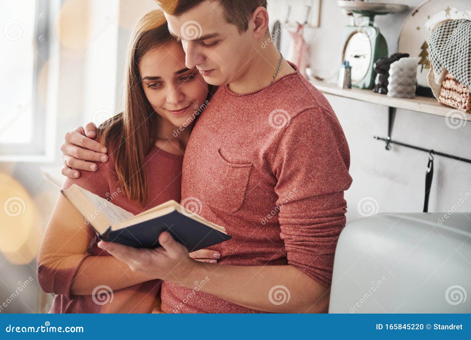 Nice People Cute Couple Reading Book Together At Home In The Kitchen