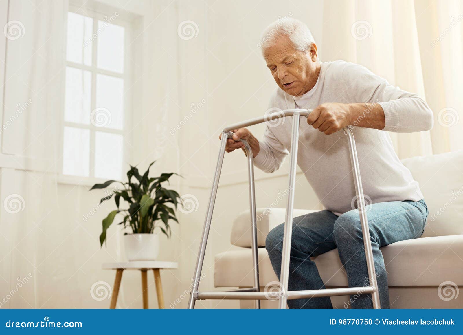 Nice Persistent Man Standing Up from the Sofa Stock Photo - Image of ...
