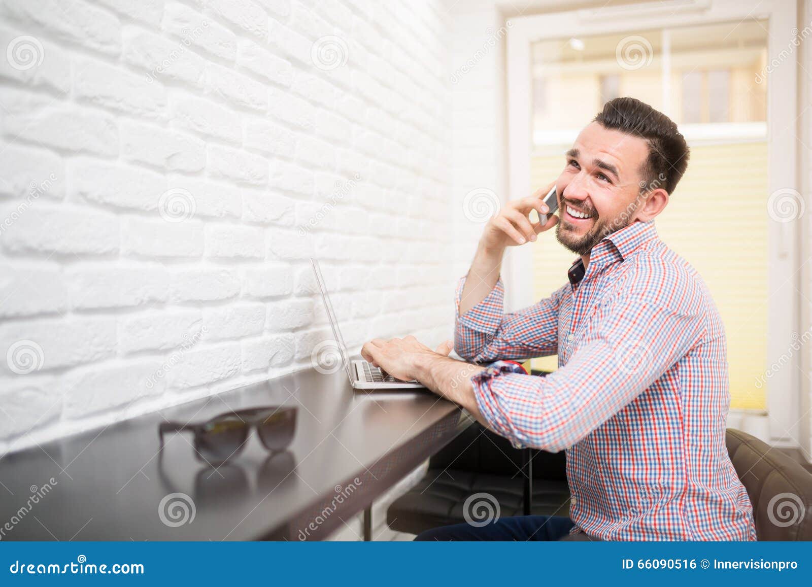 Nice Phone Conversation while Answering E-mails in Kitchen Stock Photo ...
