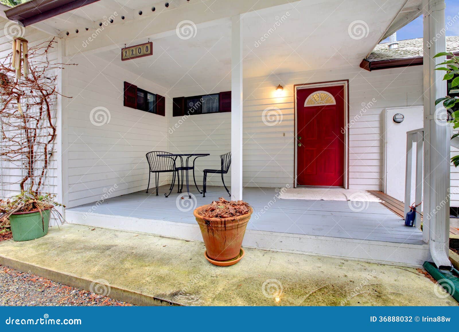 Nice Porch with a Red Door and Table Set Stock Photo - Image of ...