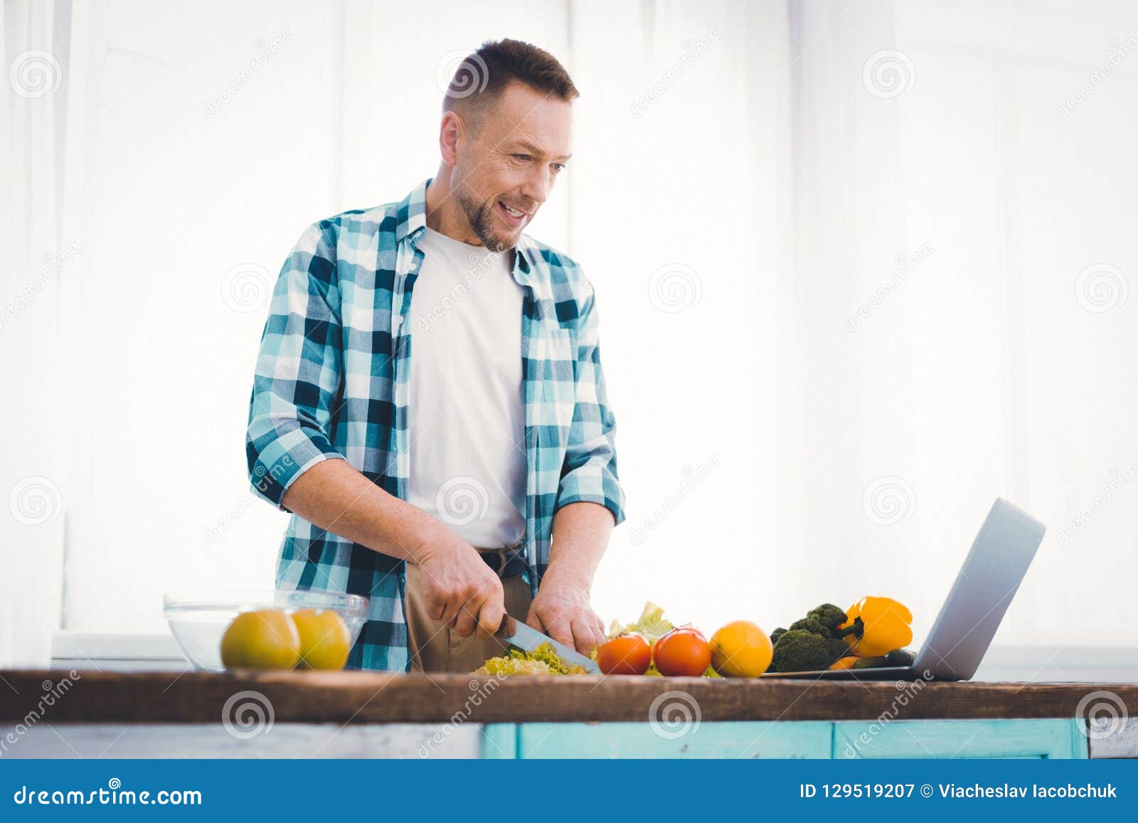 Nice Positive Handsome Man Watching a Tutorial Stock Image - Image of ...