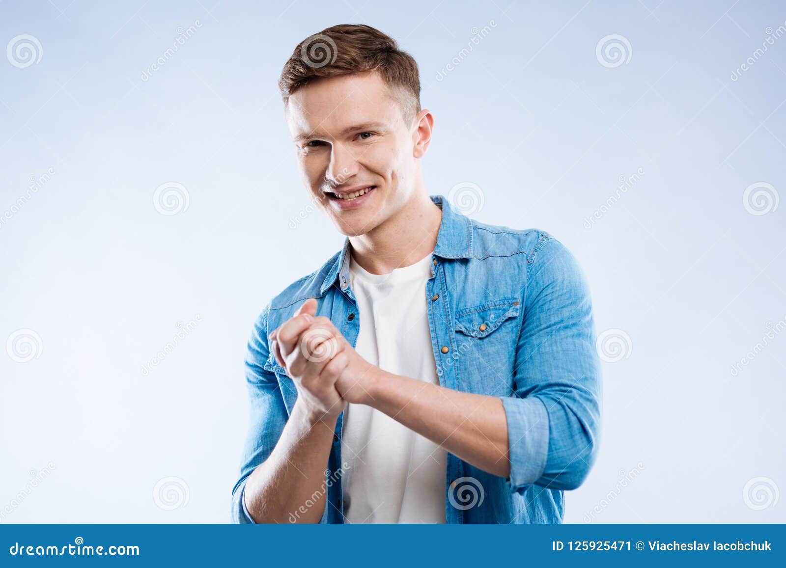 Nice Positive Man Holding His Hands Together Stock Image - Image of ...