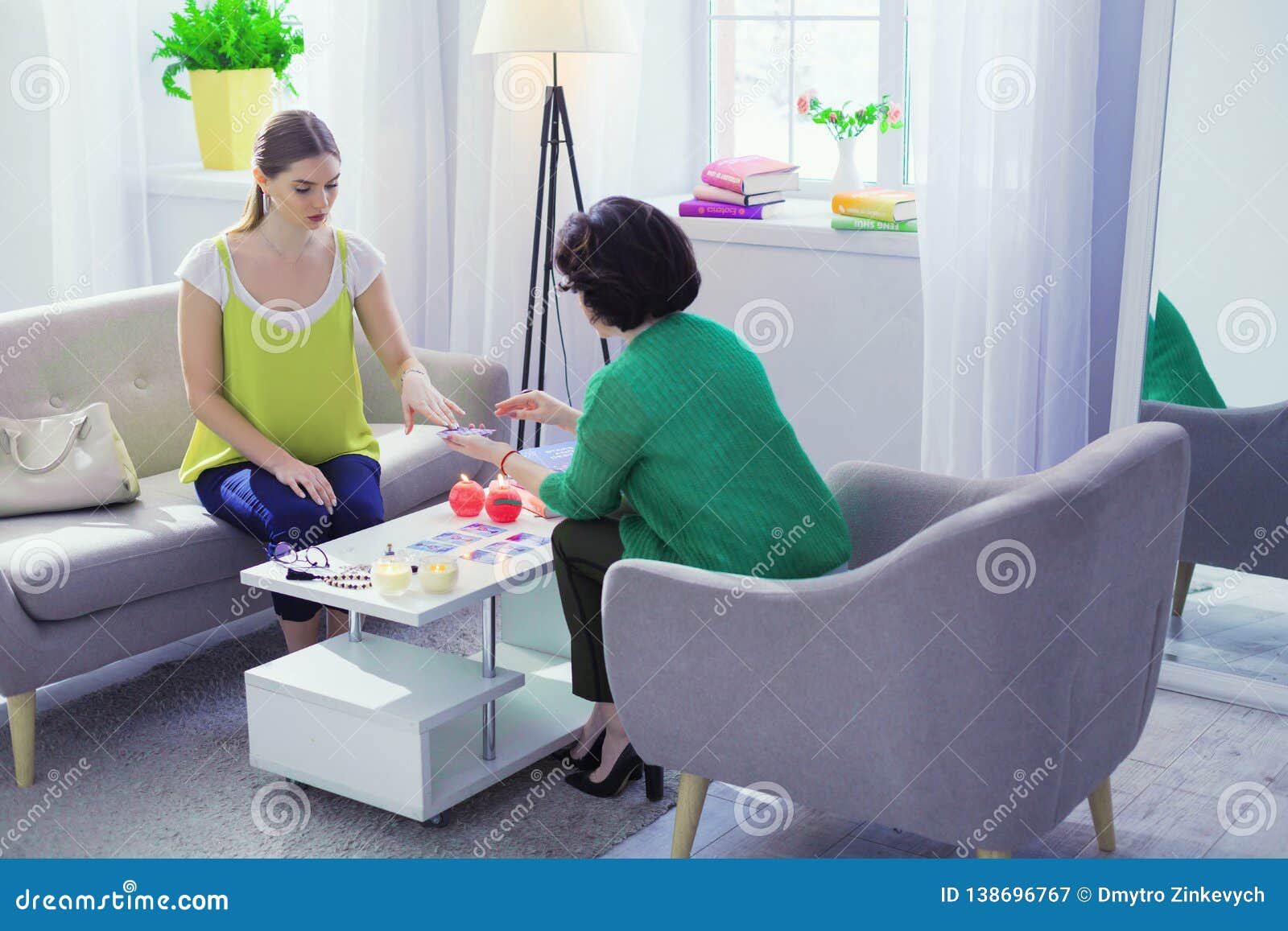 Nice Professional Fortune Teller Having a Session with Her Client Stock ...