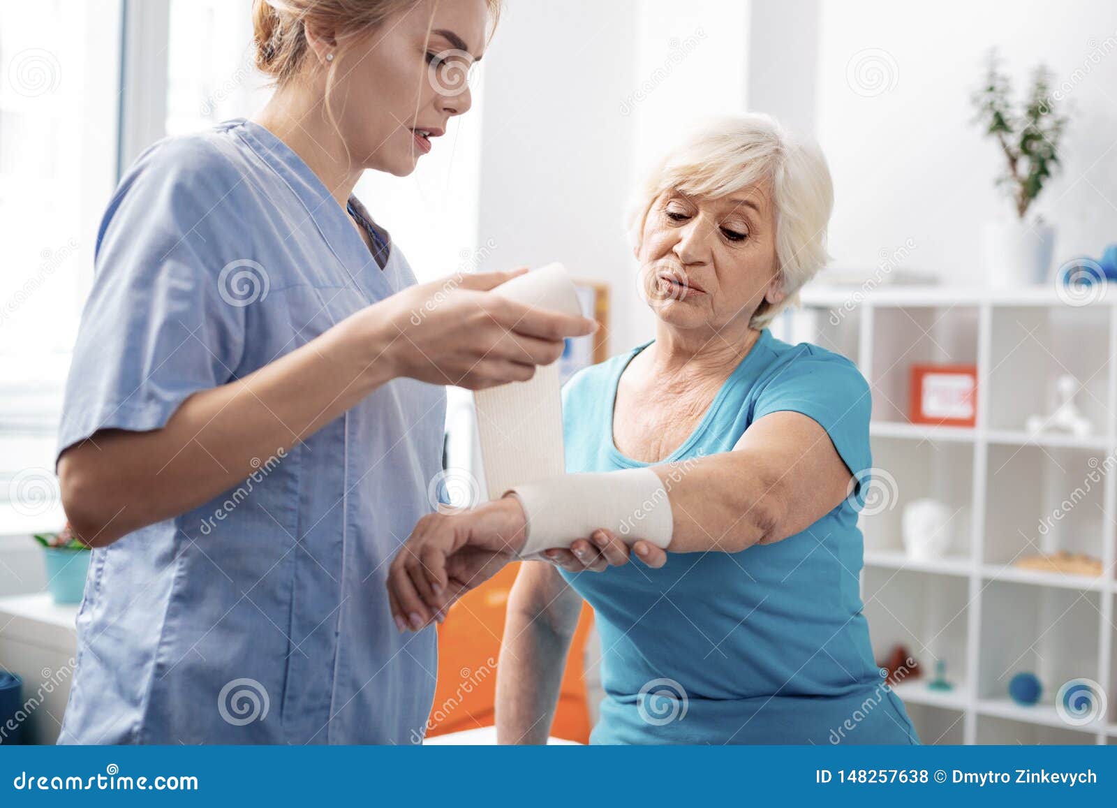 Nice Professional Nurse Using the Elastic Bandage Stock Photo - Image ...