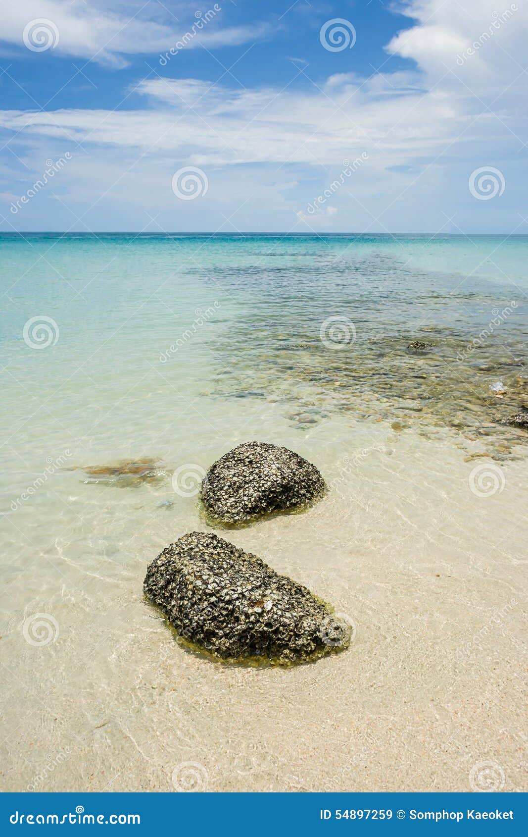 Nice Rocks in the Clear Sea with Blue Sky and White Clouds in the ...