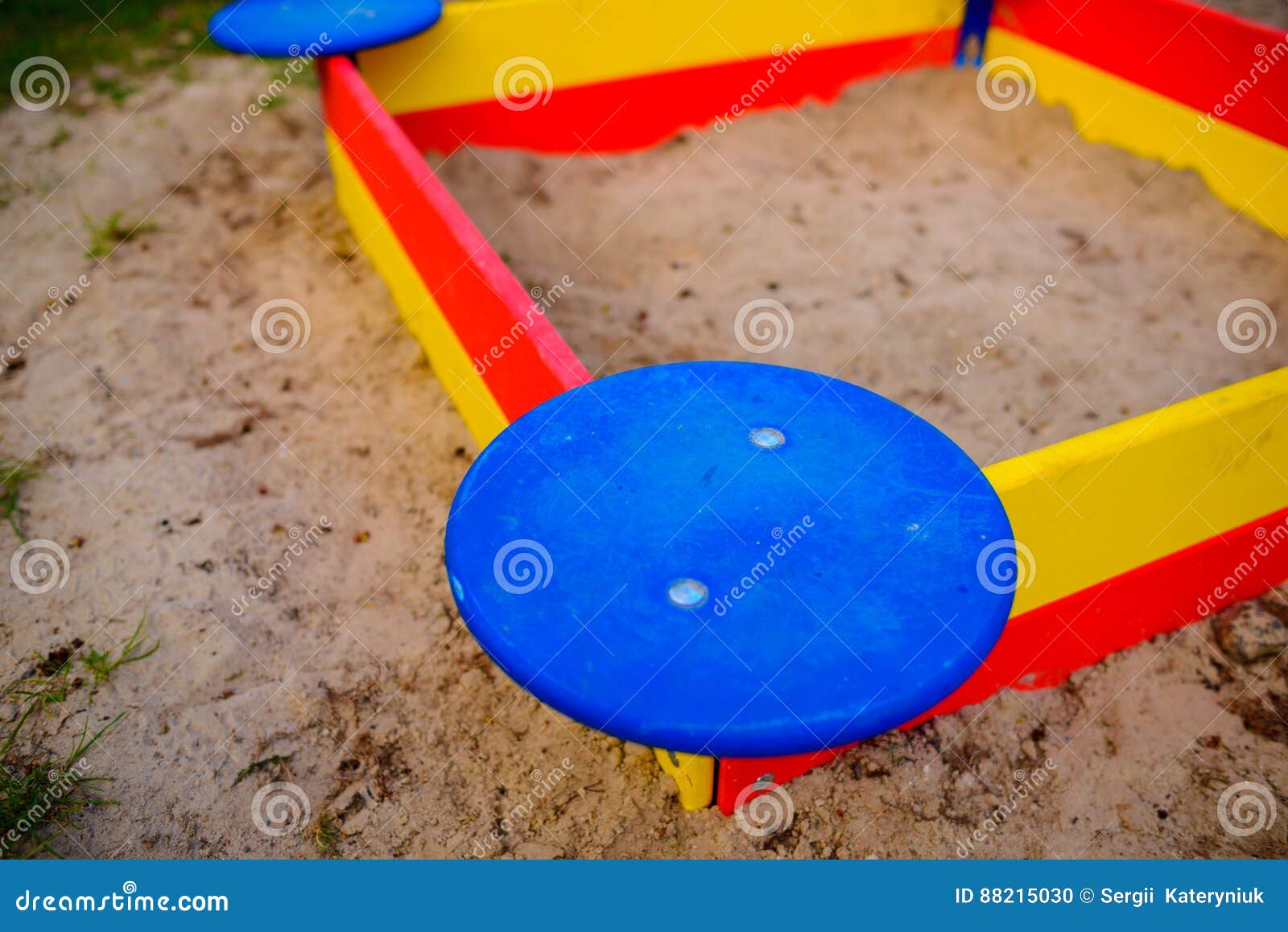 A Nice Sandbox Playground Filled . Surrounded by Green Grass, Stock ...