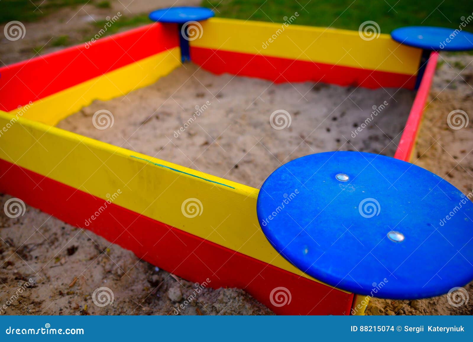 A Nice Sandbox Playground Filled . Surrounded by Green Grass, Stock ...