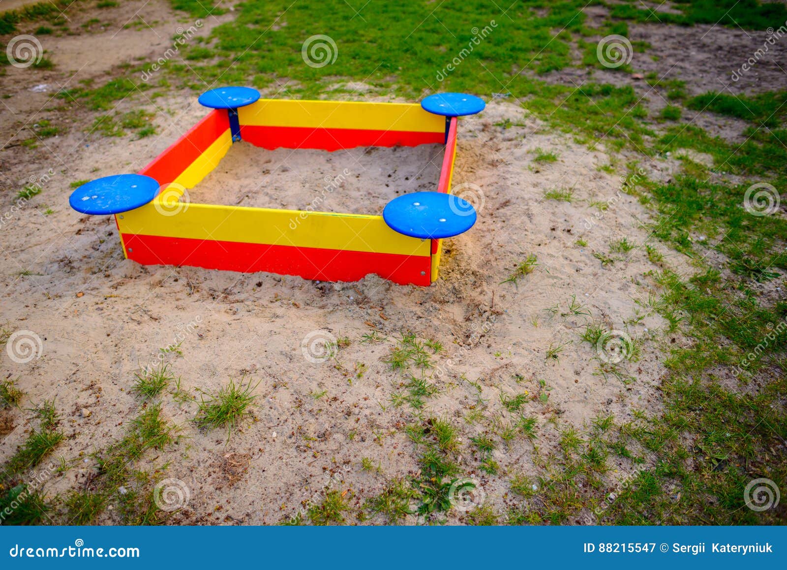 A Nice Sandbox Playground Filled . Surrounded by Green Grass, Stock ...