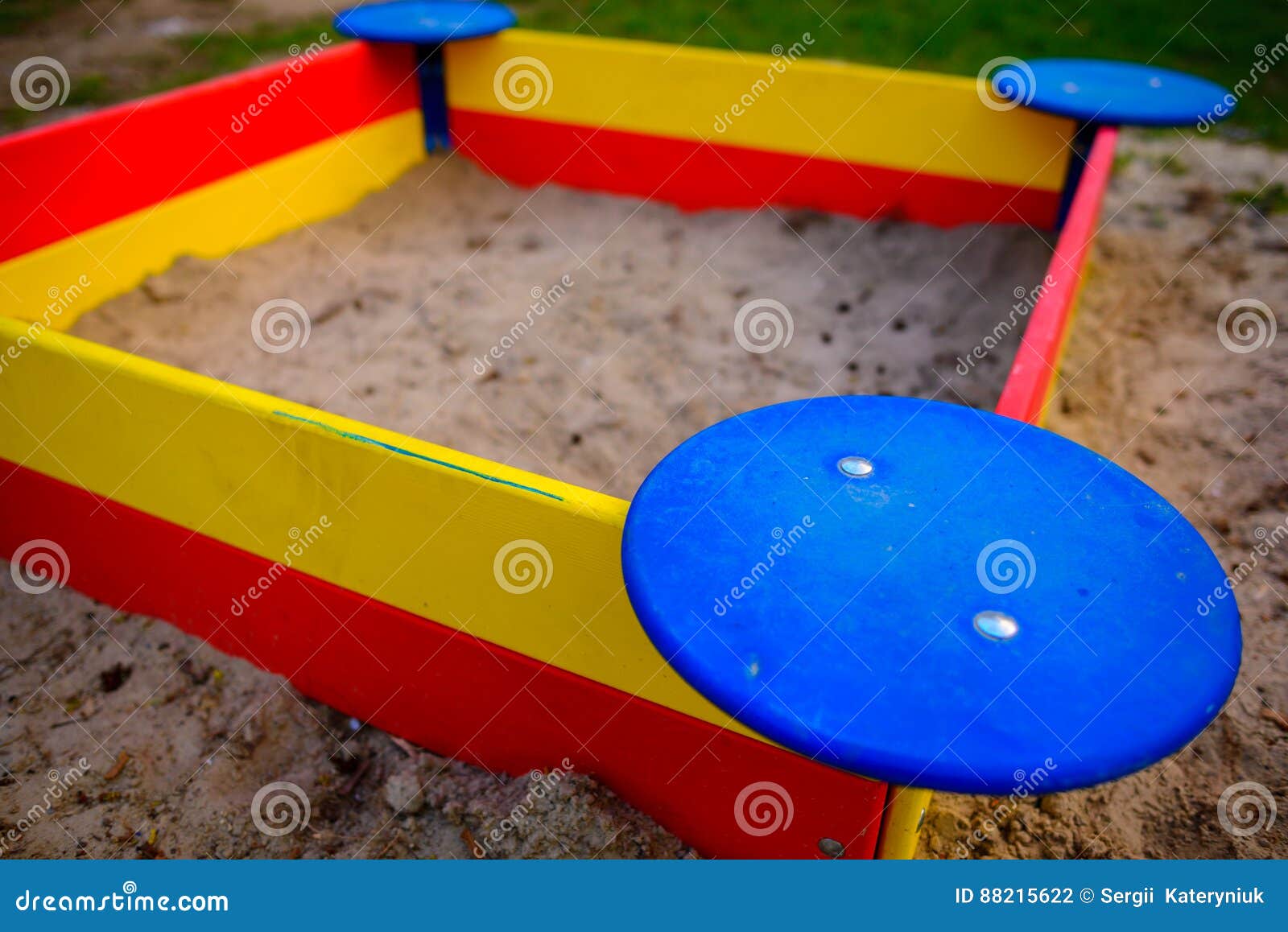A Nice Sandbox Playground Filled . Surrounded by Green Grass, Stock ...