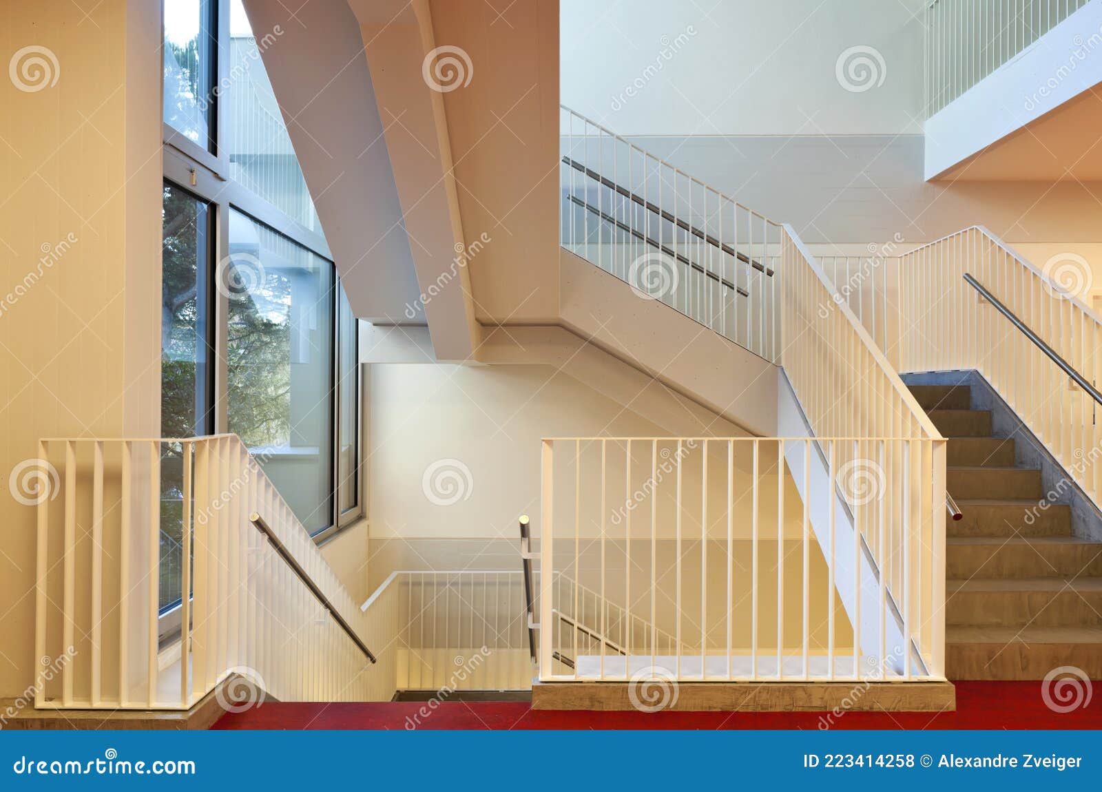 Large Staircase of Modern Public School with Red Floor and White ...