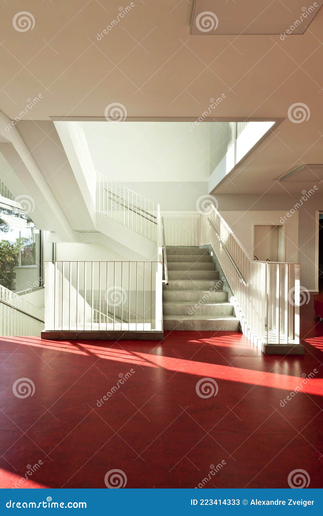 Large Staircase of Modern Public School with Red Floor and White ...
