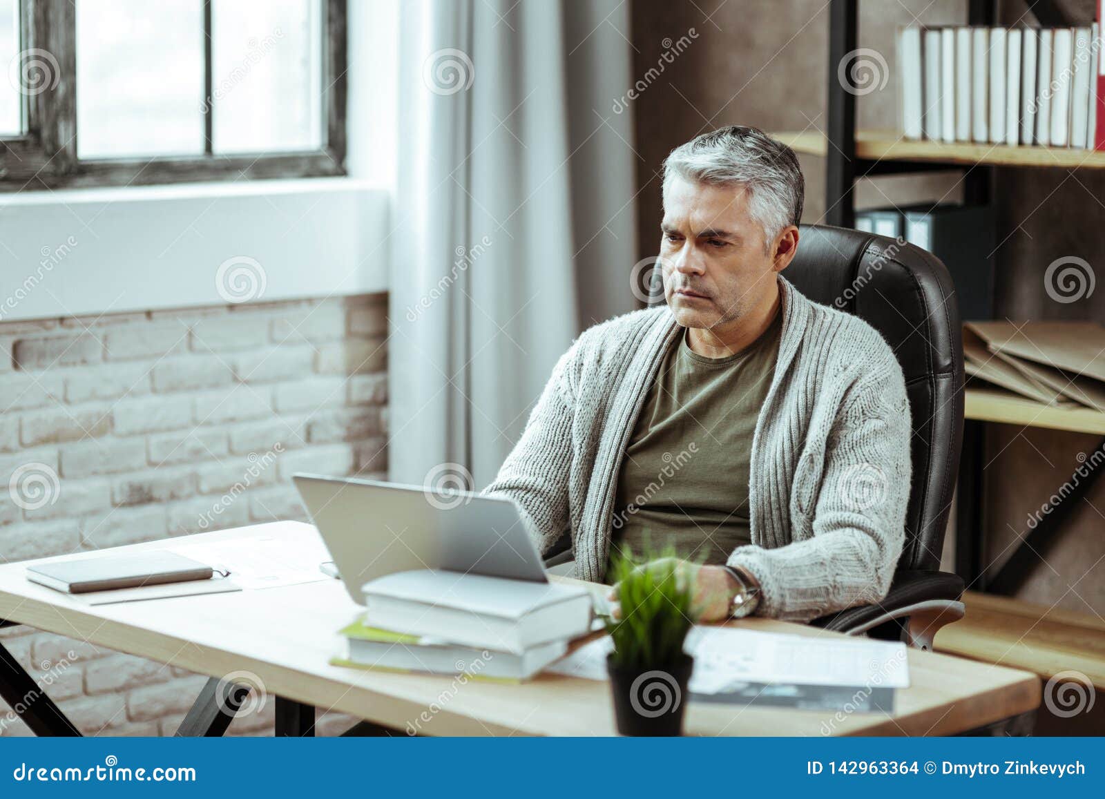 Nice Serious Man Looking at the Laptop Screen Stock Photo - Image of ...