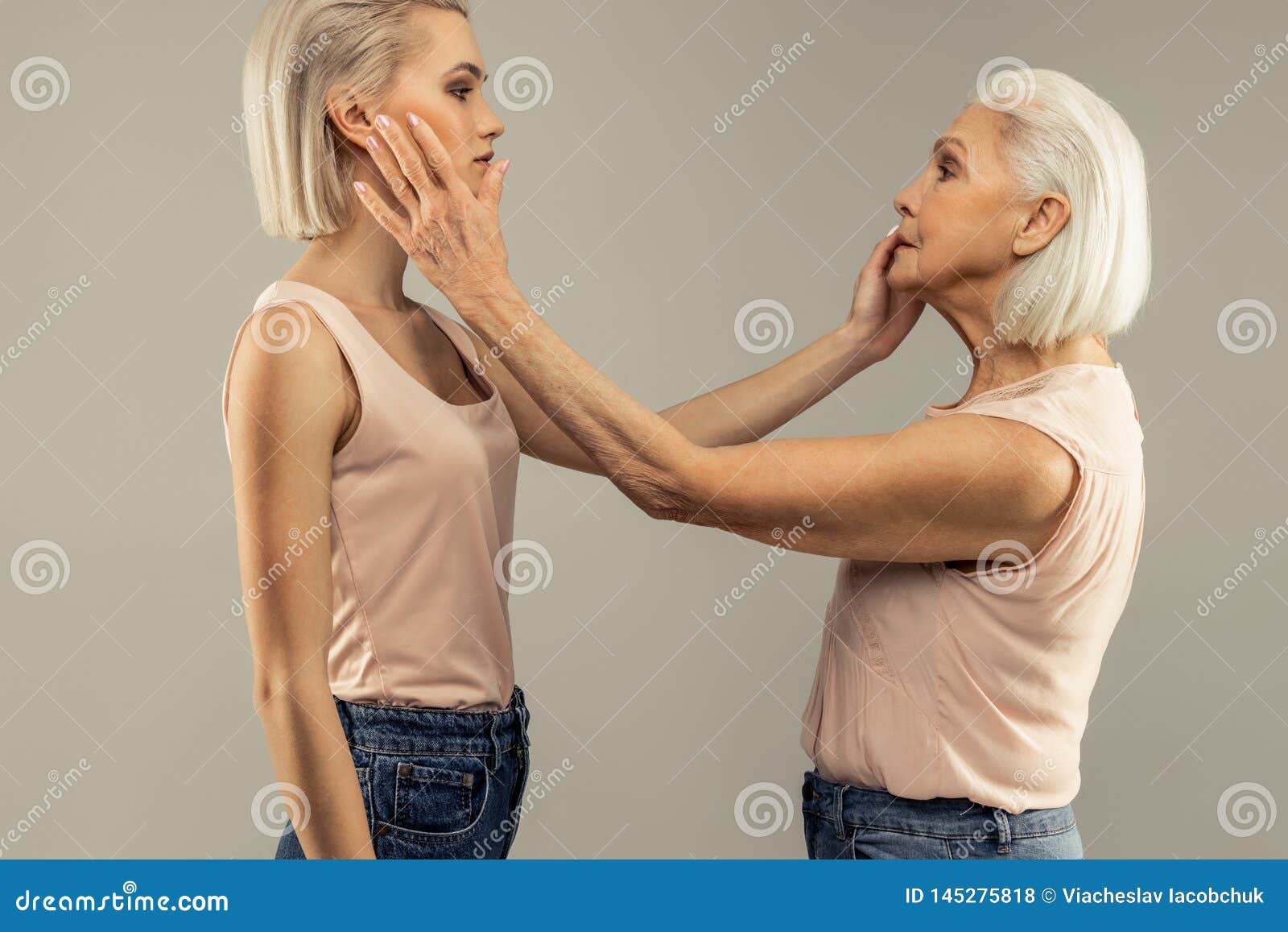 Nice Serious Women Touching Each Others Faces Stock Photo - Image of ...