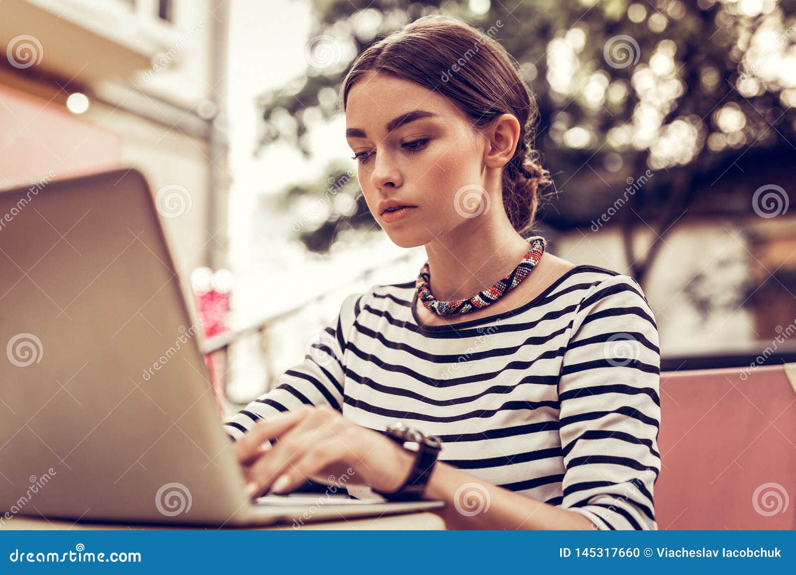 Nice Serious Young Woman Working on the Laptop Stock Photo - Image of ...