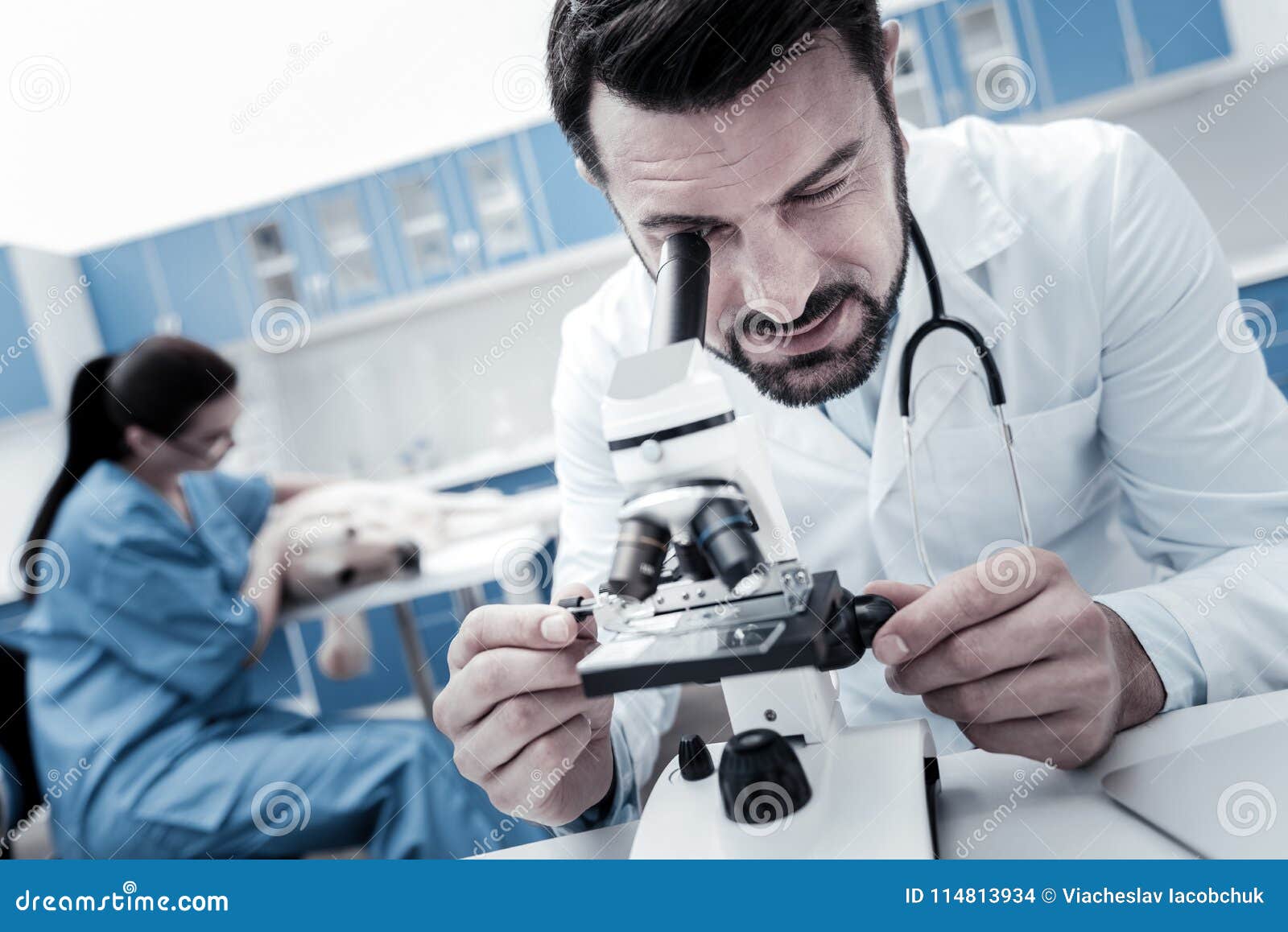 Nice Smart Man Using a Microscope Stock Photo - Image of health, doctor ...