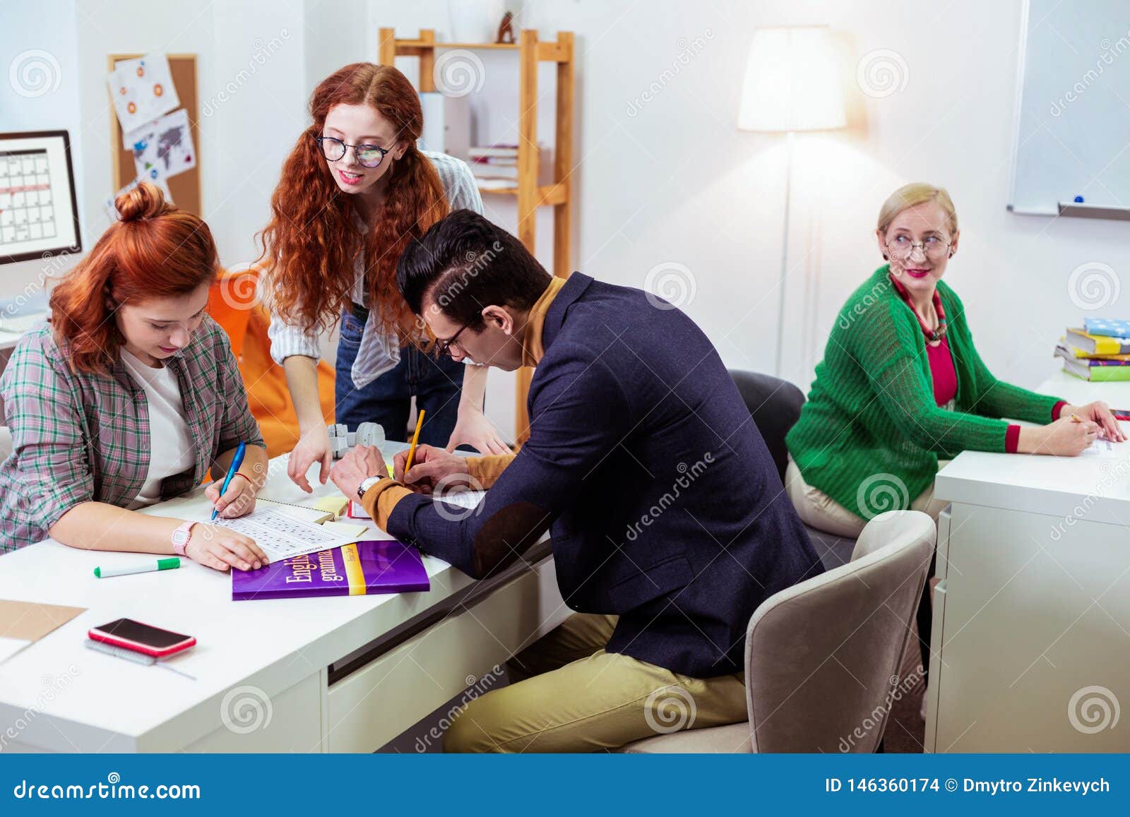 Nice Smart Young People Doing Their Assignments Stock Photo - Image of ...