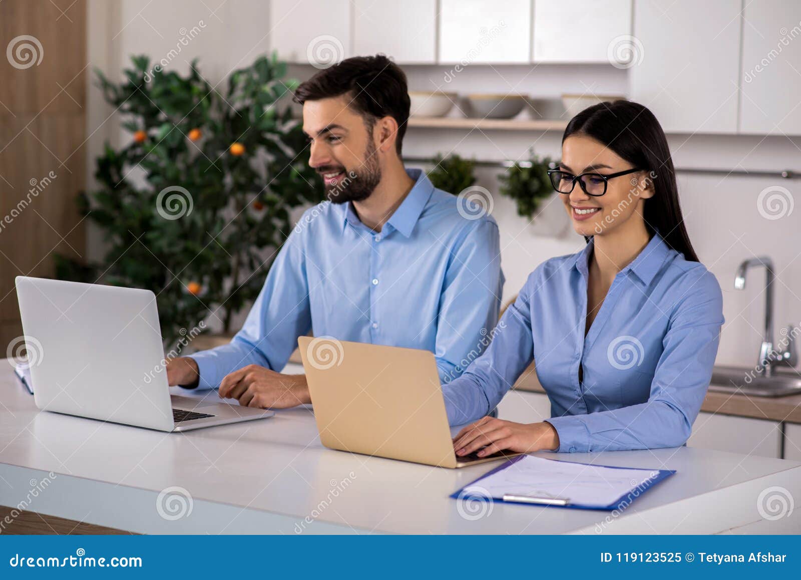 Nice Smiling Colleagues Using Laptops Stock Image - Image of cheerful ...