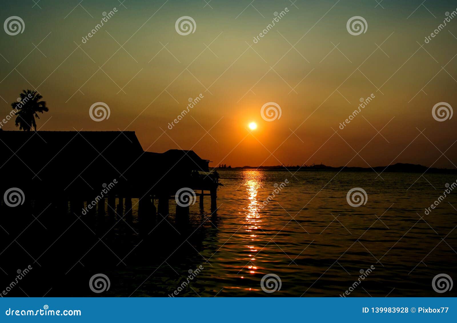Nice Sunset Sky at Sea with Silhouette of House Stock Photo - Image of ...