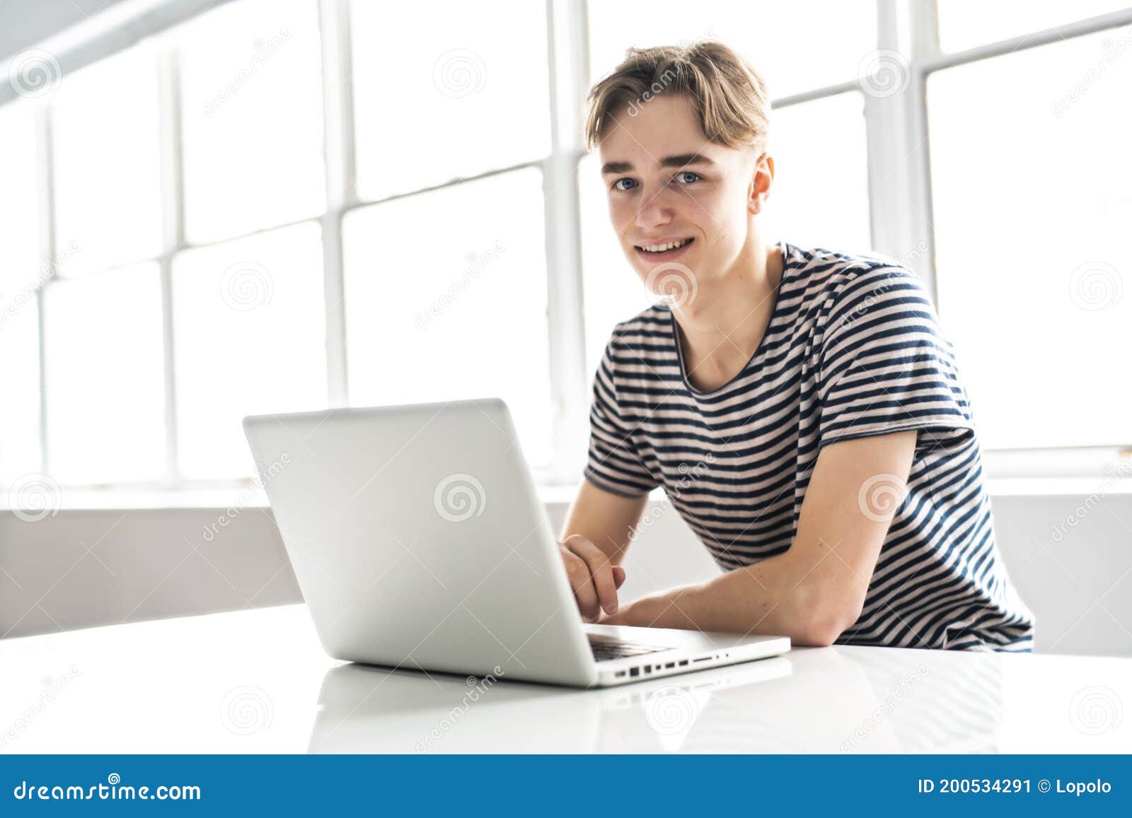 A Nice Teenage Boy Using Laptop at Home Stock Image - Image of school ...