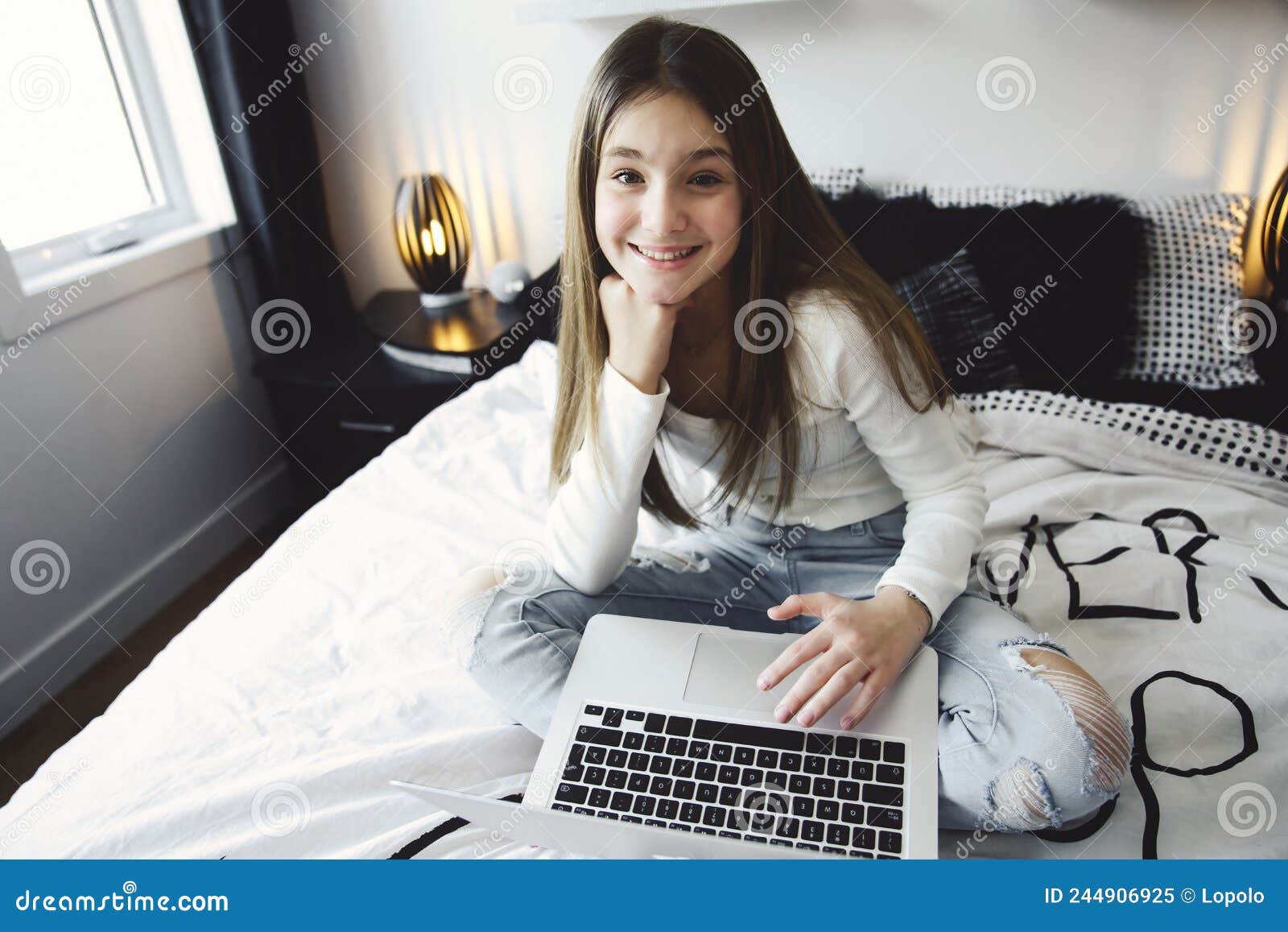 Nice Teenage Girl Using a Computer in Her Bedroom. Stock Image - Image ...