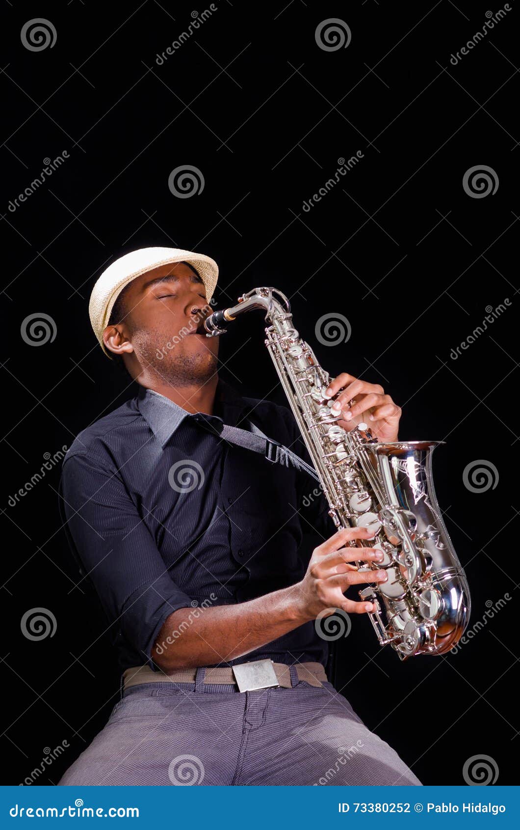 A Nice View from Below, Black Man is Playing the Saxophone ...