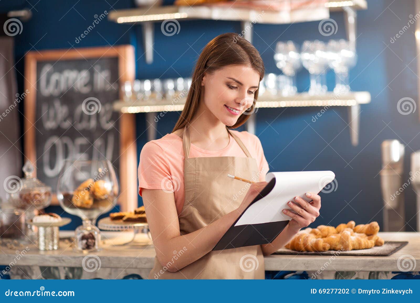 Nice waitress making notes stock photo. Image of open - 69277202
