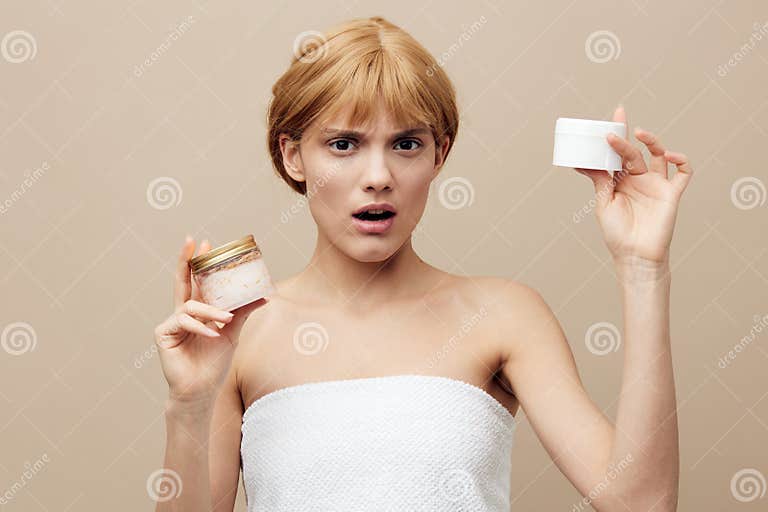 A Nice Woman In A Towel With Well Groomed Skin Red Hair Pinned Back