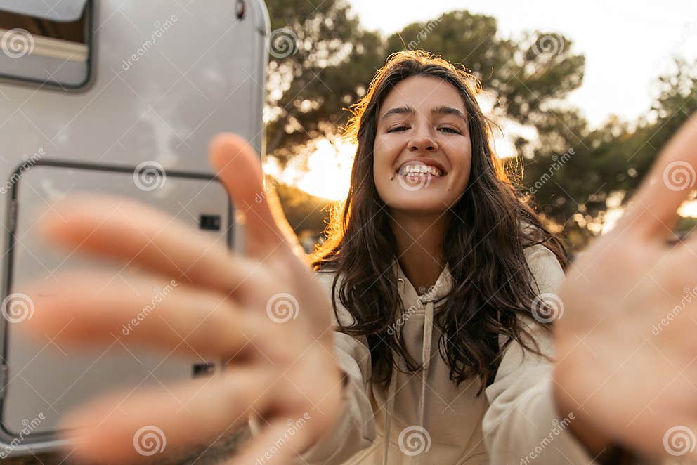 Nice Young Caucasian Girl Stretches Her Hands To Camera Smiling Broadly